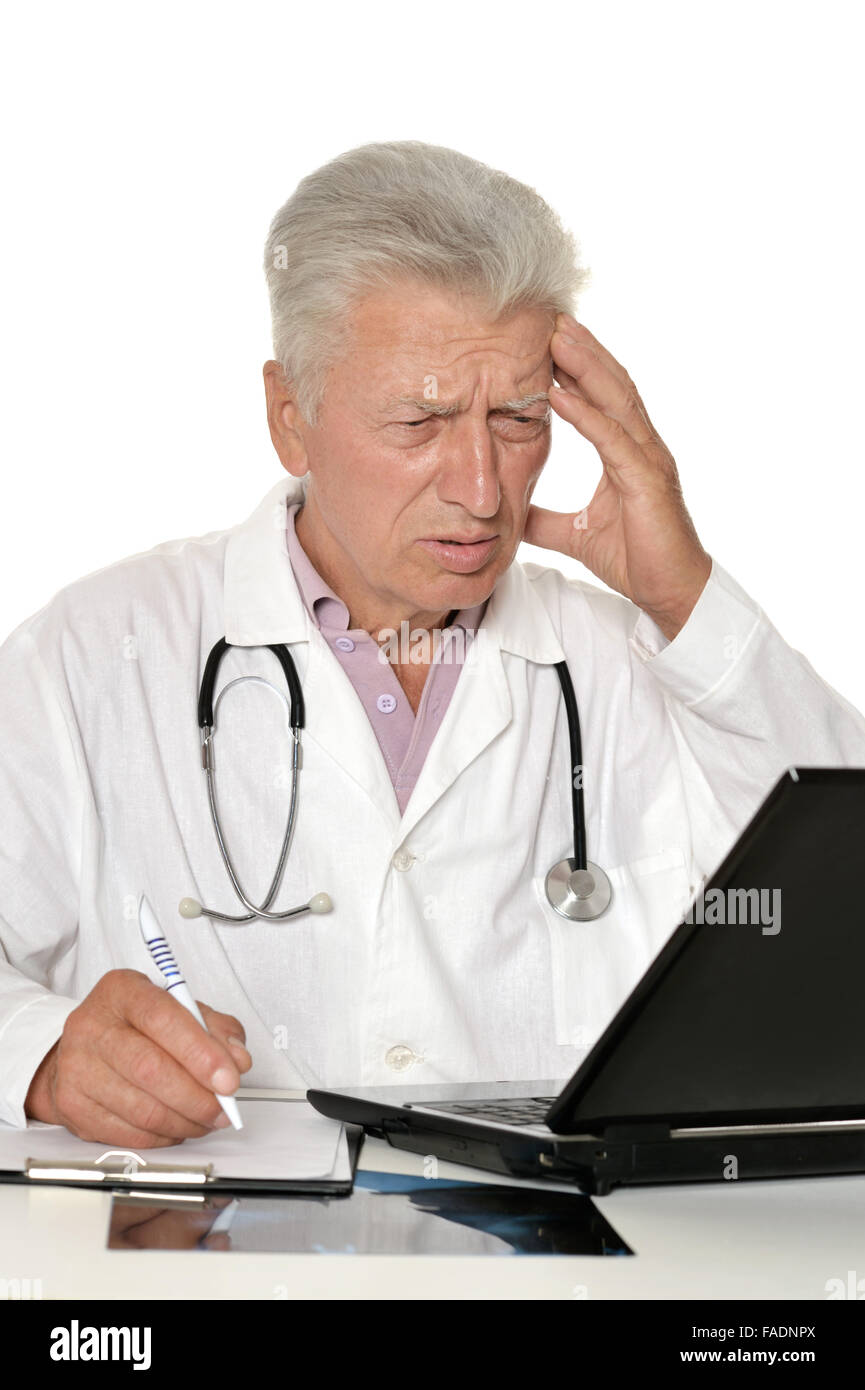 Elderly doctor with laptop Stock Photo - Alamy