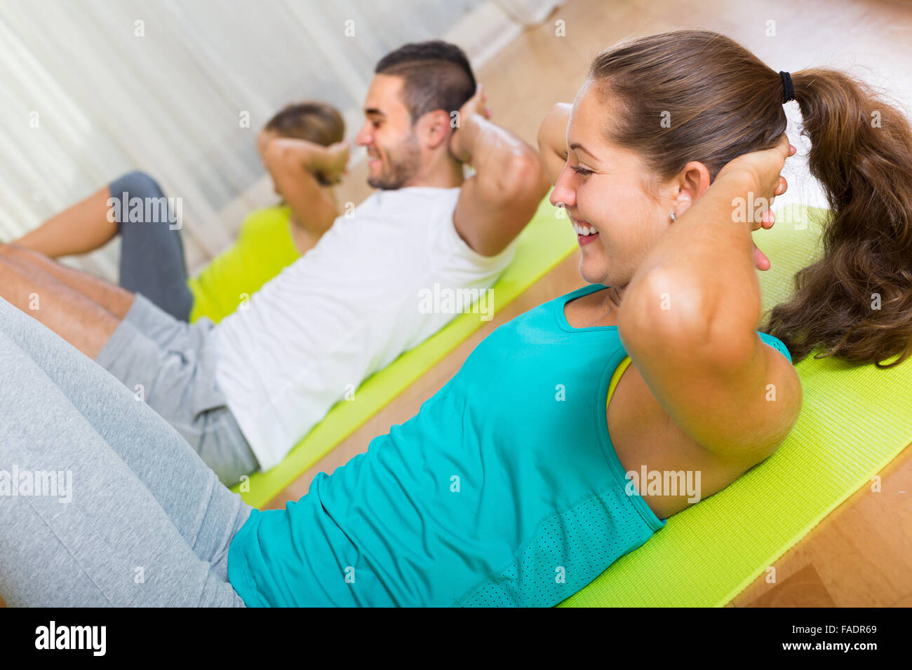 Group having fitness class in gym. Focus on girl Stock Photo - Alamy