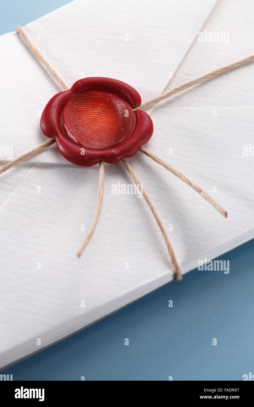 Thumbprint wax seal on envelope Stock Photo - Alamy