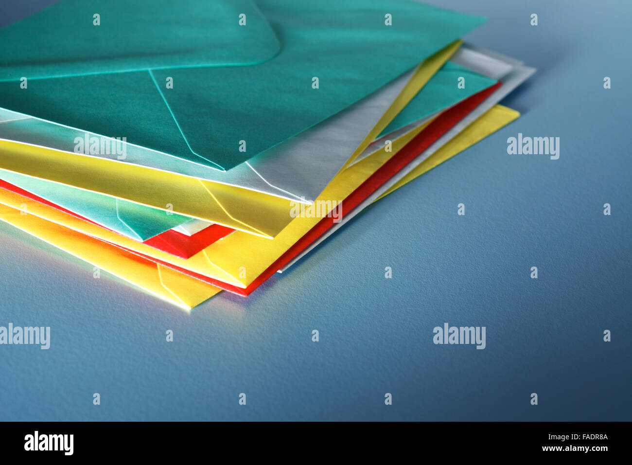 Close up pile of coloured envelopes Stock Photo - Alamy