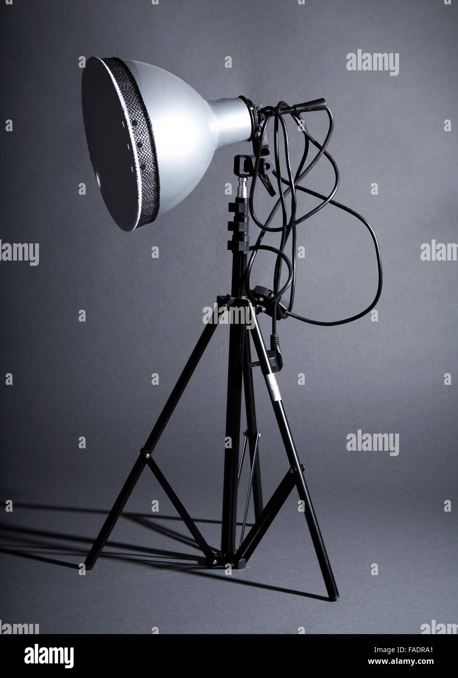 Photographic reflector on a grey background Stock Photo - Alamy