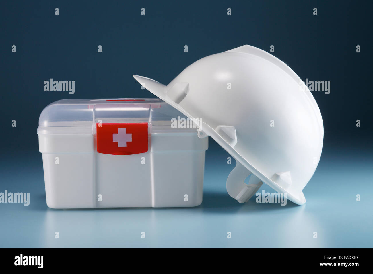 first aid kit and contstruction hard hat Stock Photo - Alamy