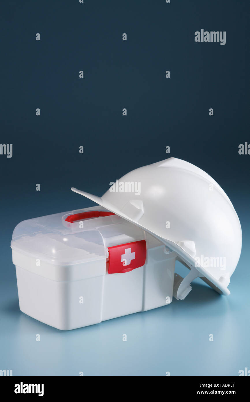first aid kit and contstruction hard hat Stock Photo - Alamy