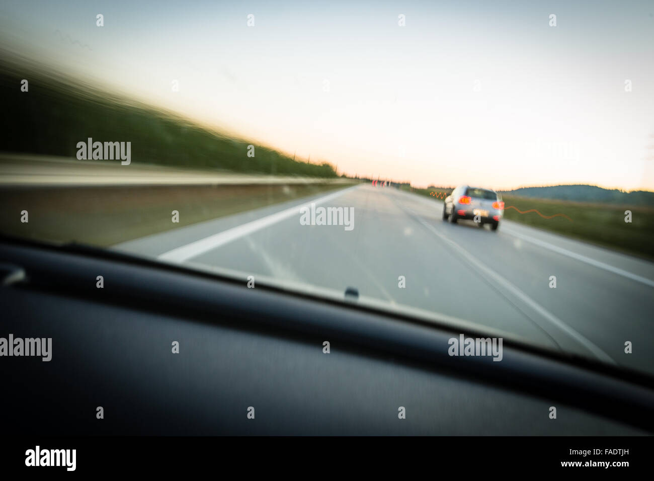 Cars moving fast on a highway (motion blurred image Stock Photo - Alamy