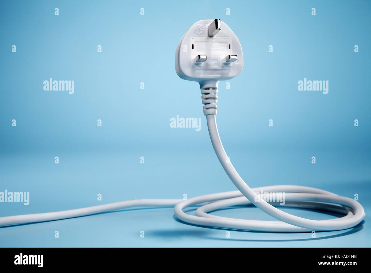 White electricity cable curled up like a cobra Stock Photo - Alamy