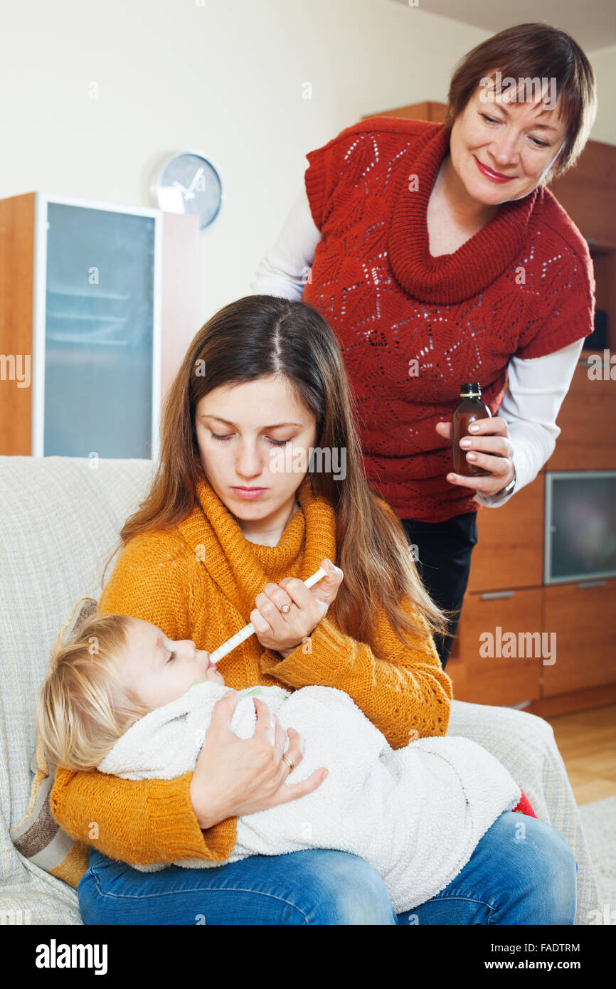Mother nursing sick child hi-res stock photography and images - Alamy
