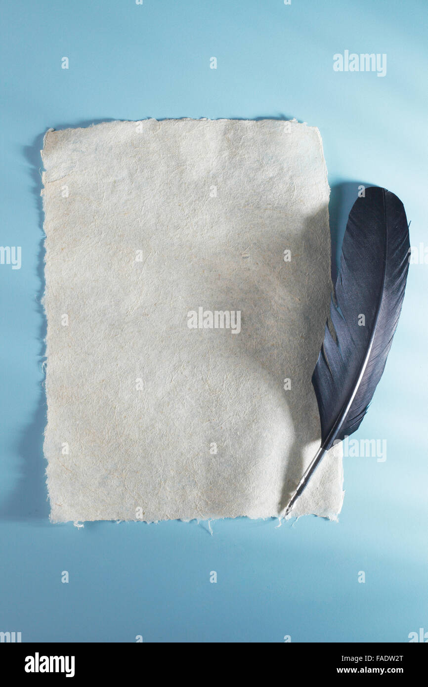 Quill pen on blank note pad Stock Photo - Alamy