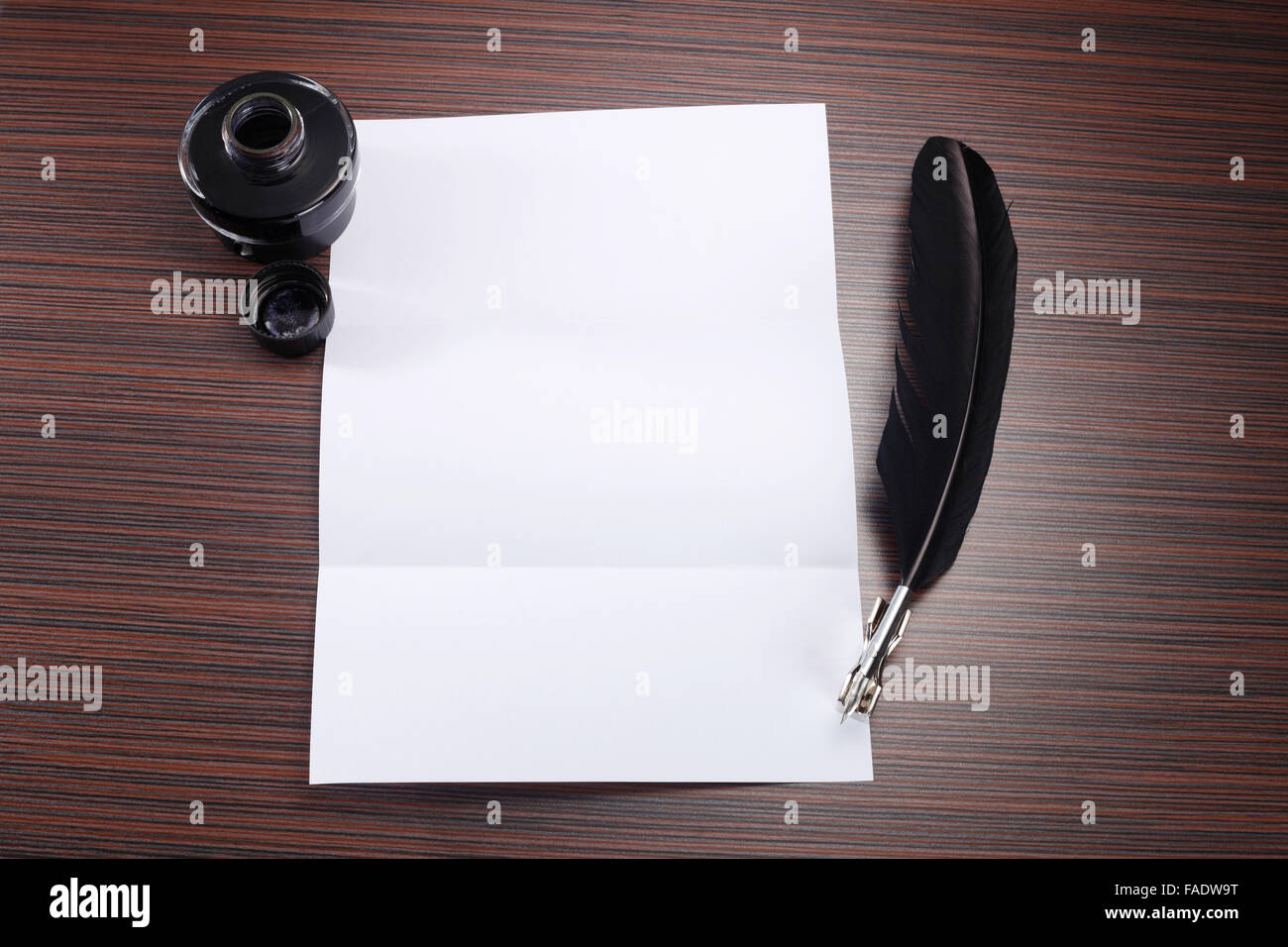 quill pen on the blank note Stock Photo - Alamy
