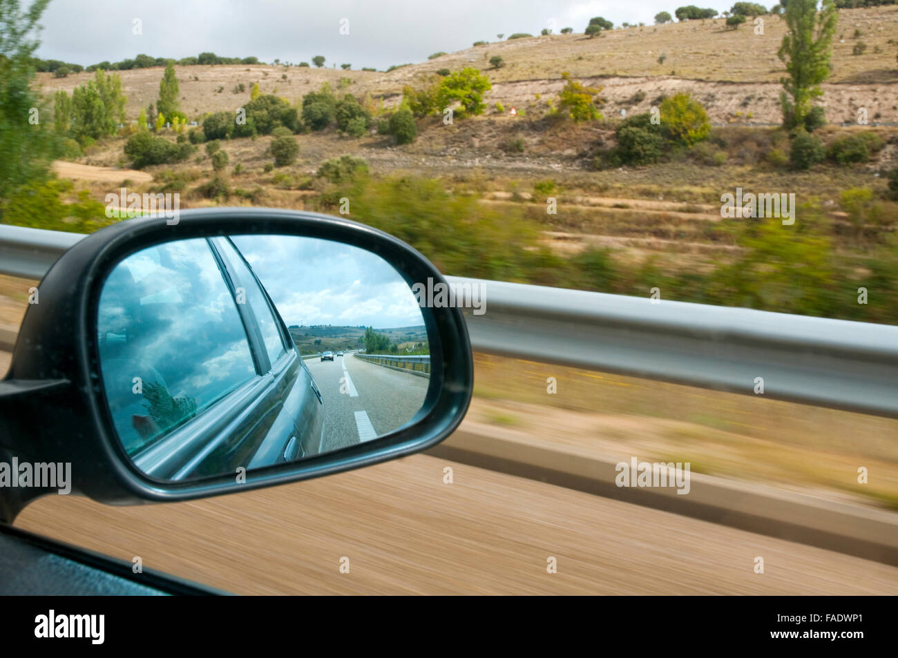 Road reflected on rear view mirror Stock Photo - Alamy