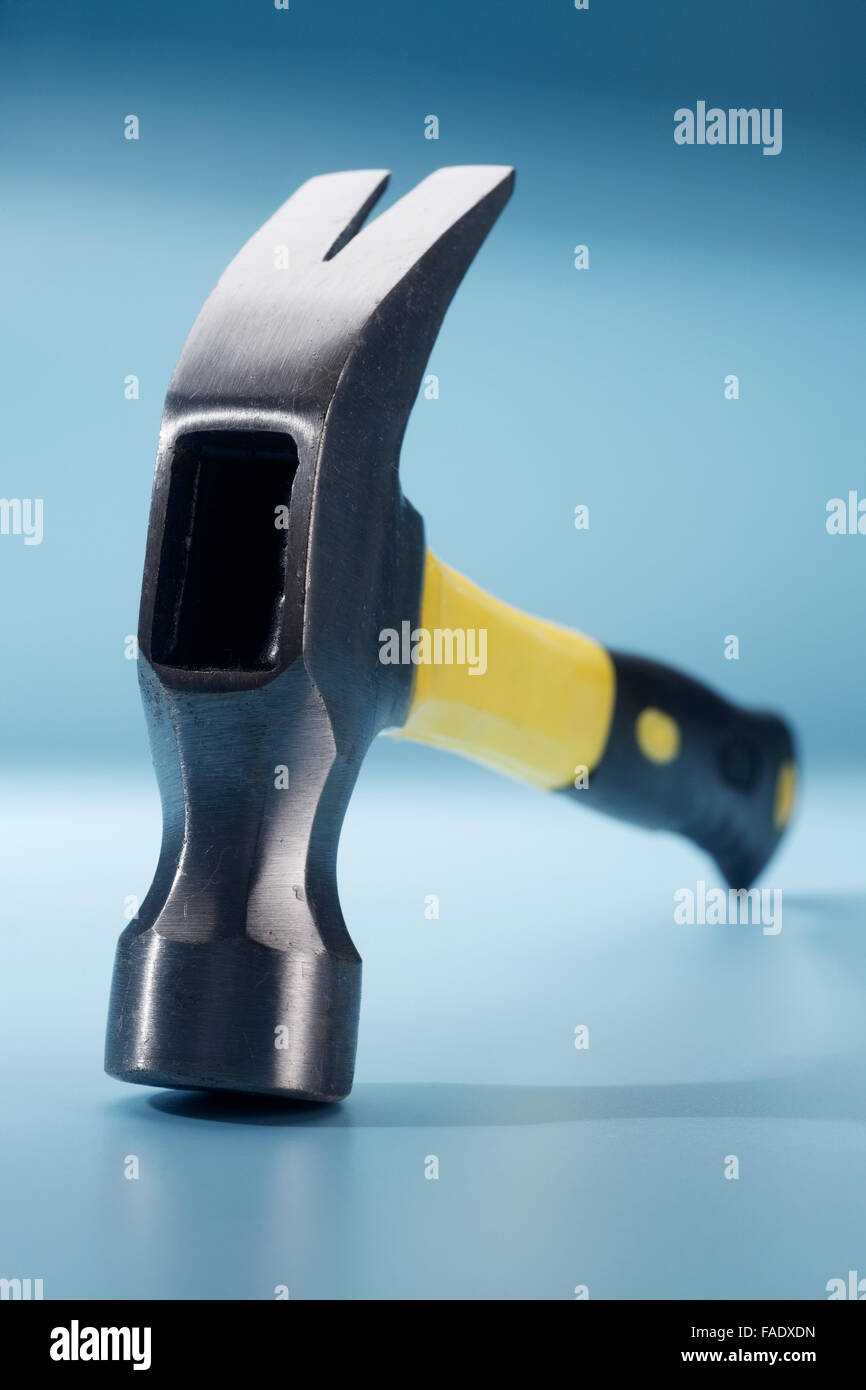 close up of the Hammer on the blue background Stock Photo - Alamy