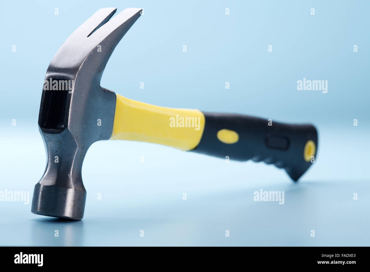 close up of the Hammer on the blue background Stock Photo - Alamy
