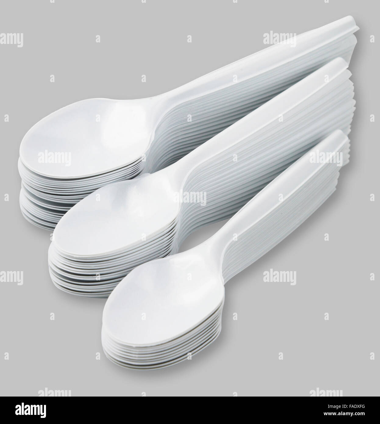stack of the disposable white spoon Stock Photo - Alamy