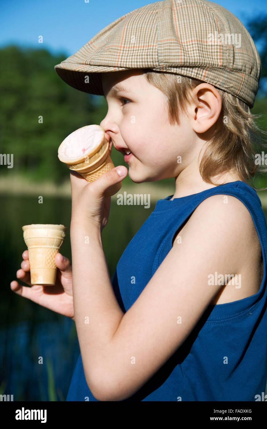 The little boy, eats tasty ice-cream Stock Photo - Alamy