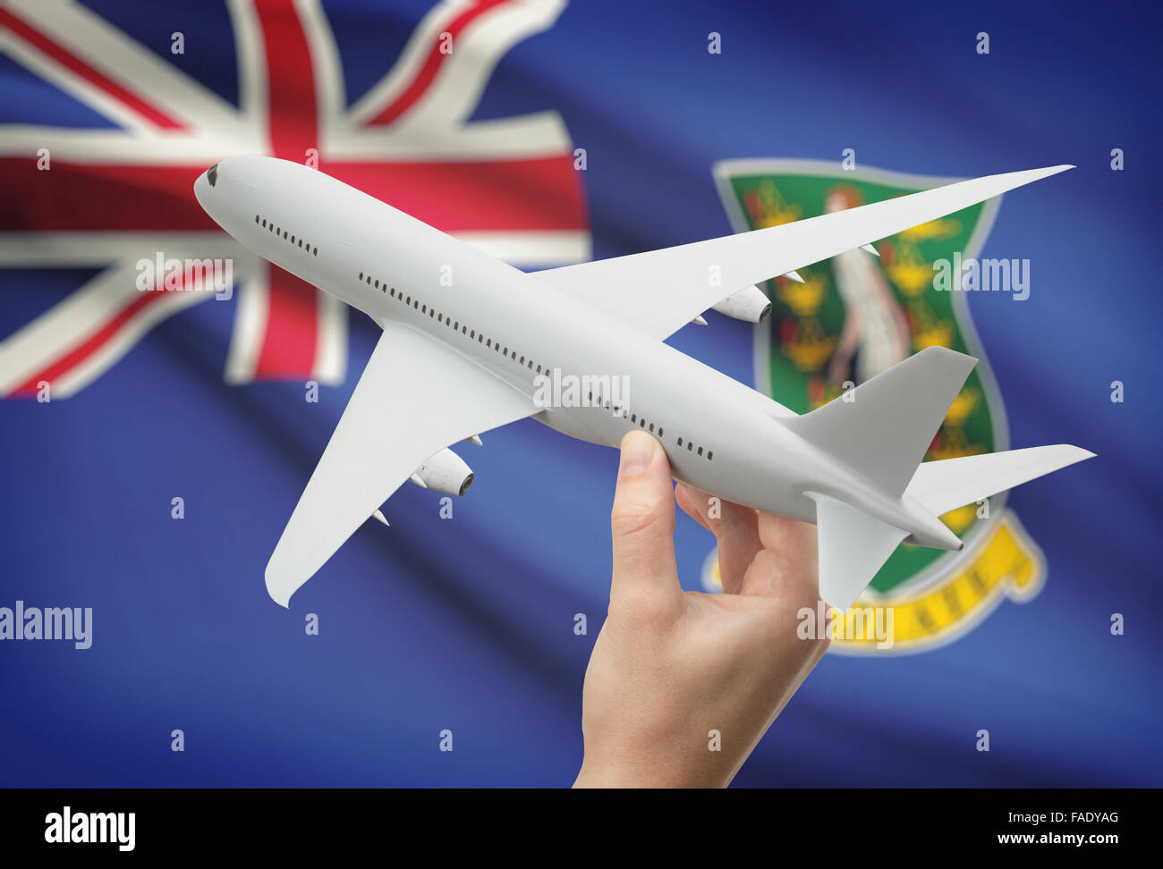 Airplane in hand with national flag on background - British Virgin ...