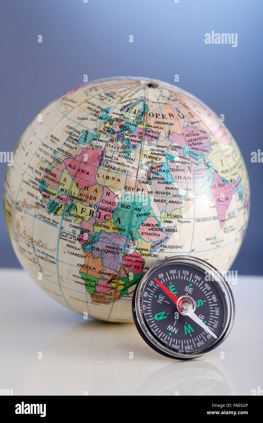 studio shot of the compass and globe Stock Photo - Alamy