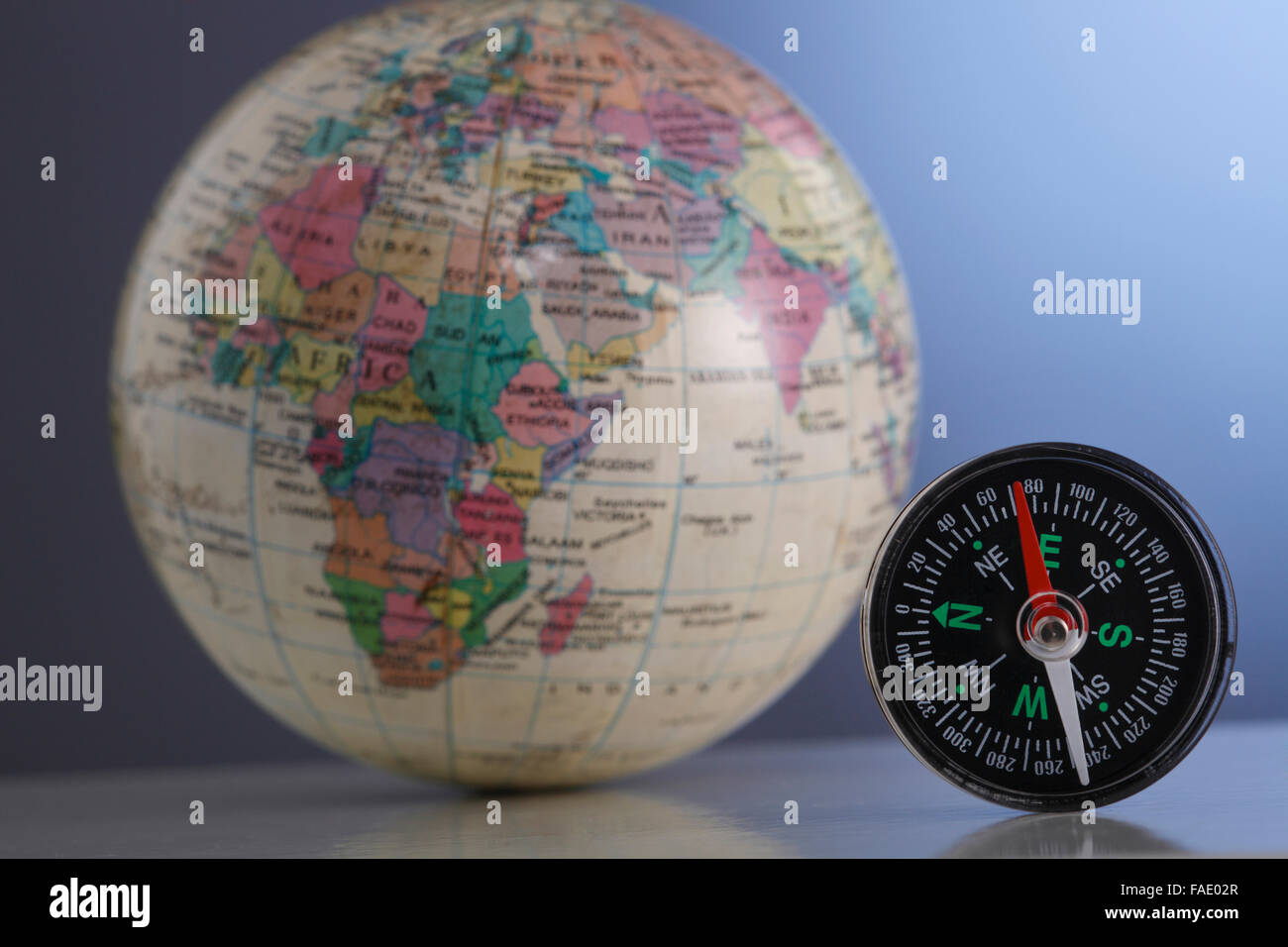studio shot of the compass and globe Stock Photo - Alamy