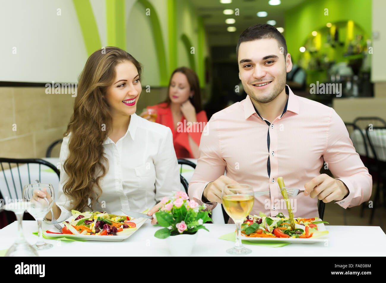 Adult guests resting and eating in modern cafe Stock Photo - Alamy