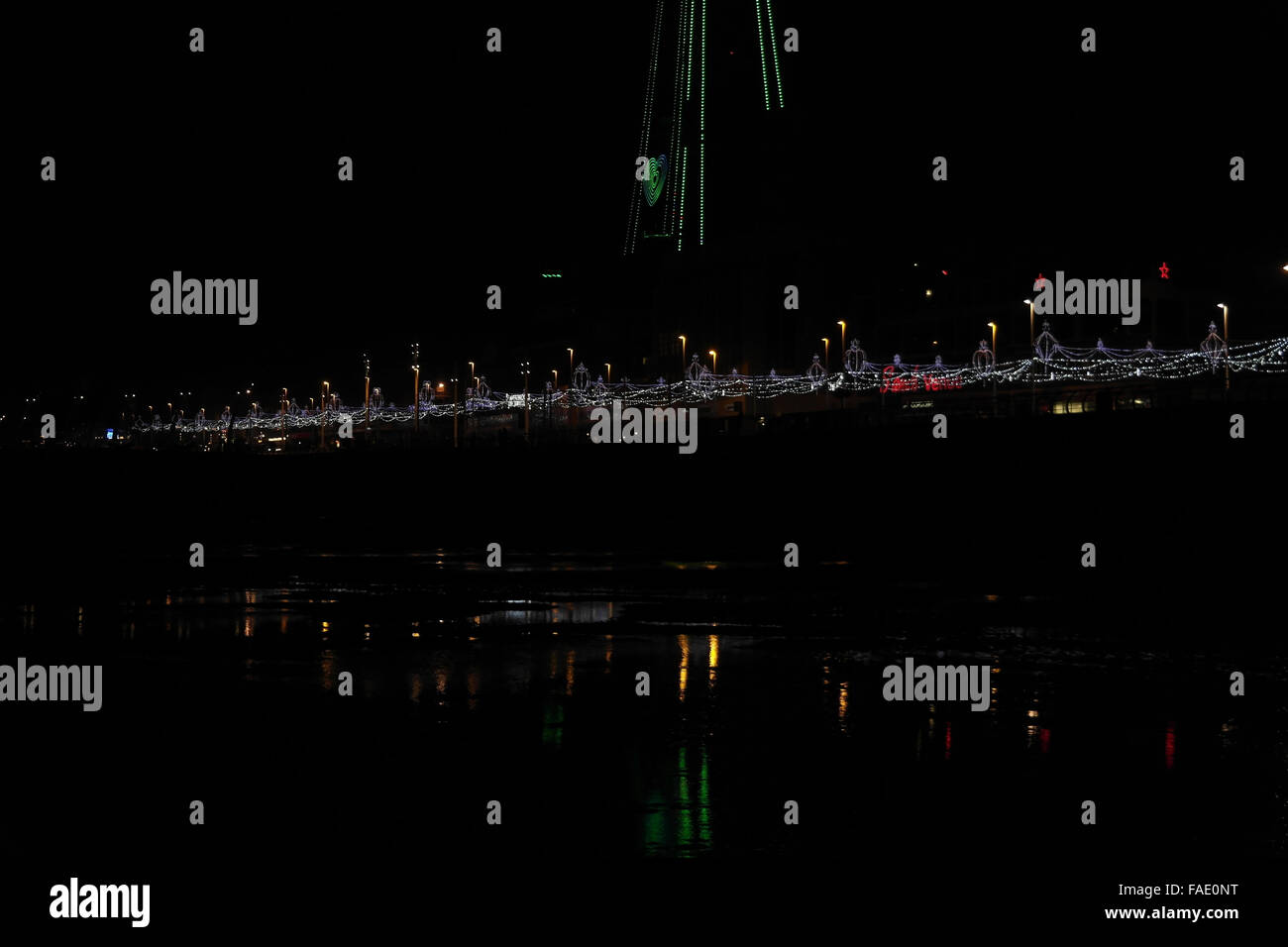 Night oblique beach view, with reflections, to Bling Illuminations ...