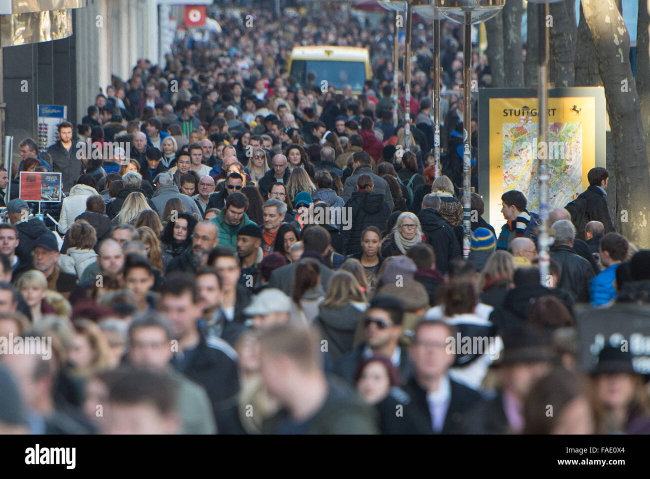 Stuttgart, Germany. 28th Dec, 2015. People walk across Koenigsstrasse ...