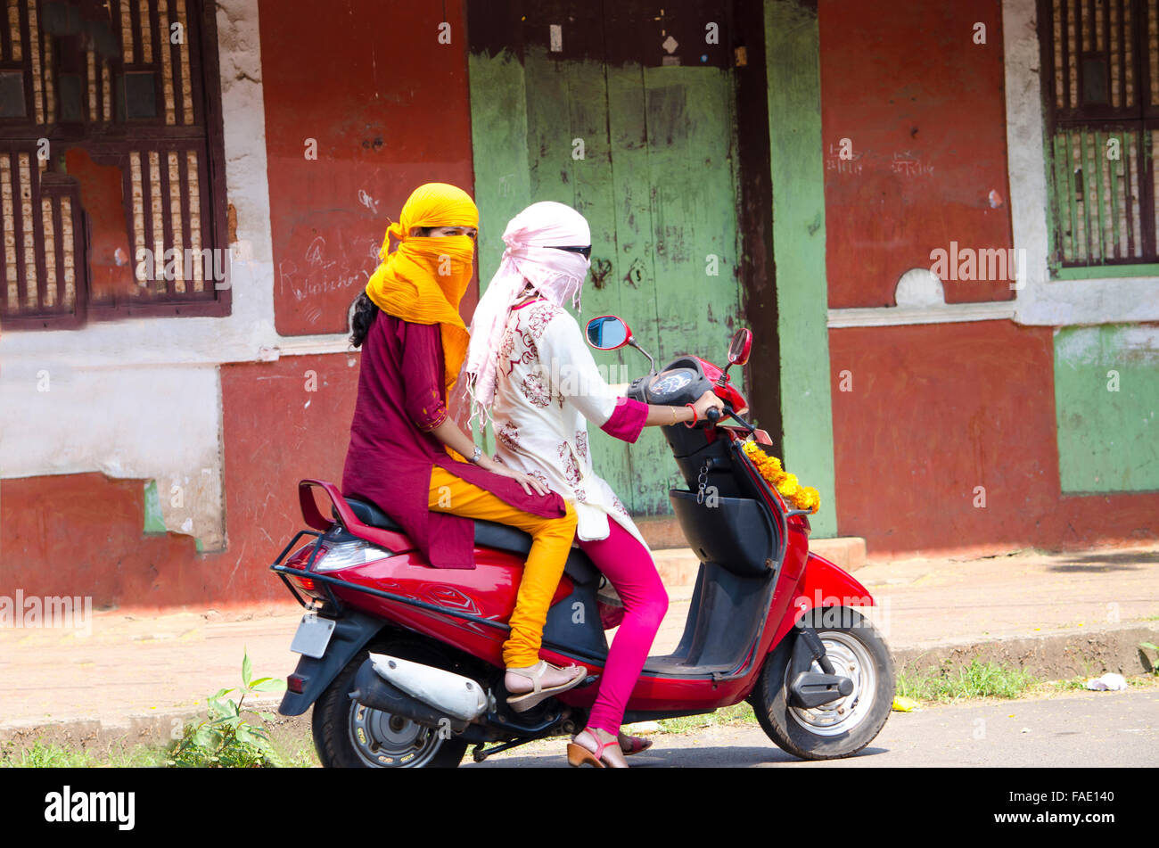 girls on transport in Muslim national clothes,girls,a trip,a bike ...