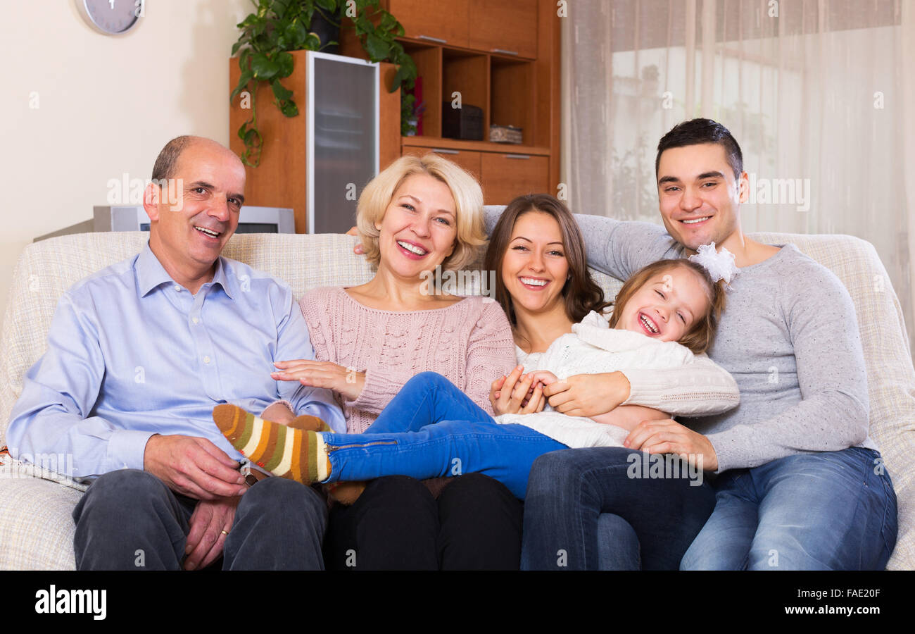 Long family with grand children posing indoors Stock Photo - Alamy