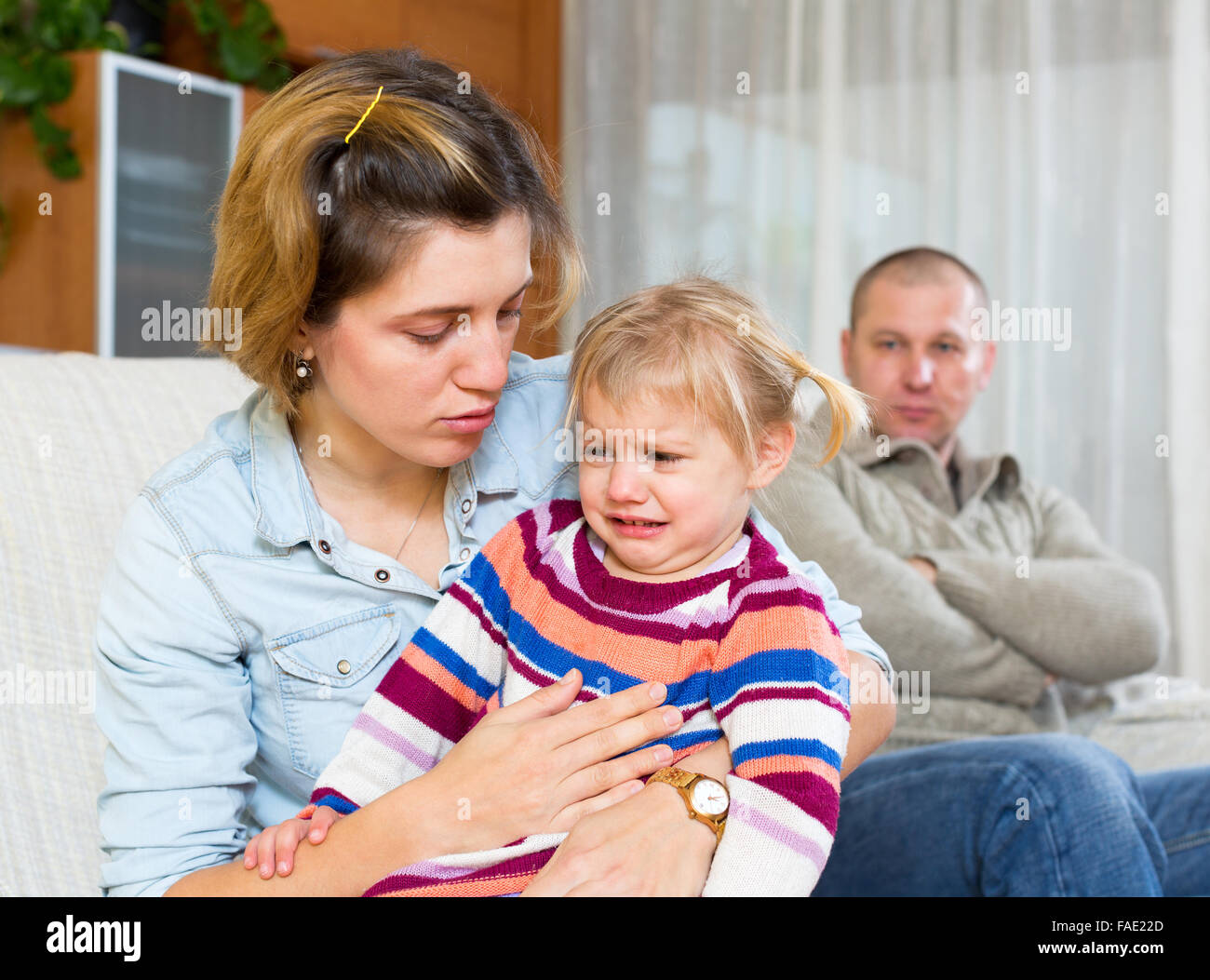 Family conflict. Woman with children against husband after quarrel at ...