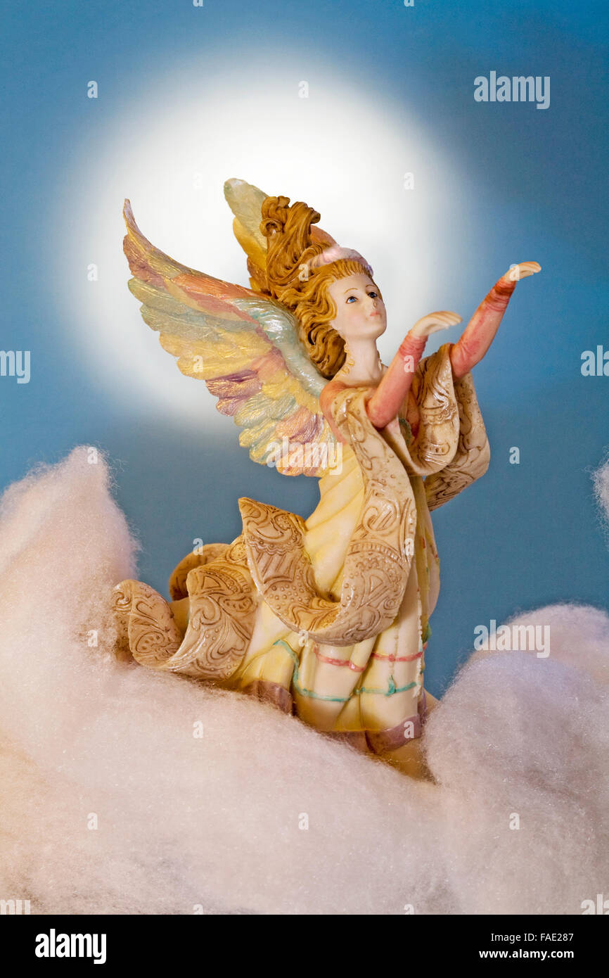 An angel on a cloud in heaven Stock Photo - Alamy