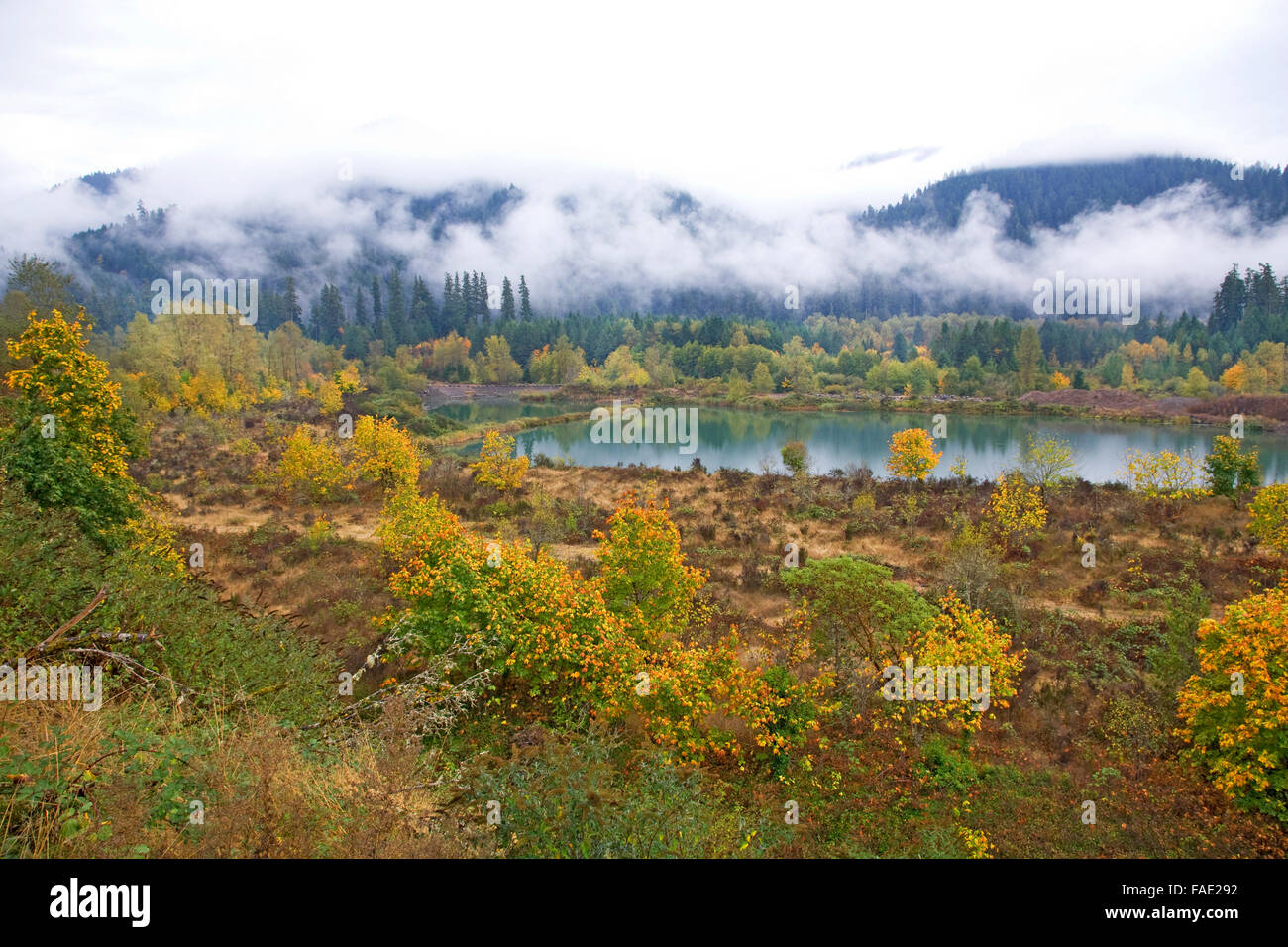 Mist and fog hang over the Cascade Mountains of central Oregon near the ...