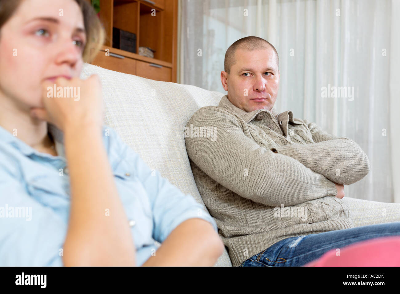 Family quarrel. Angry adult man against and crying young woman Stock ...