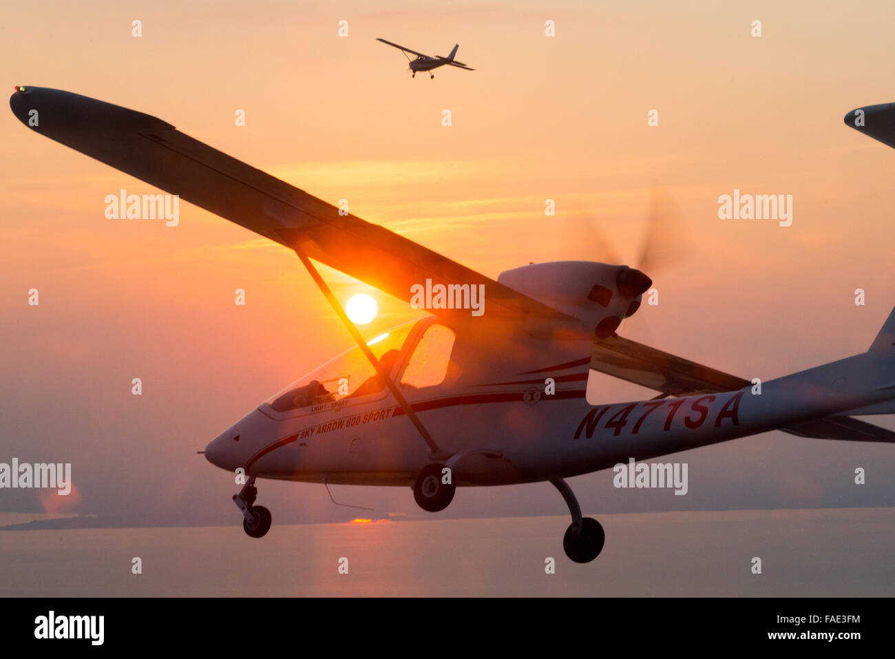 Aerial view of two planes at sunset during a formation flight Stock ...