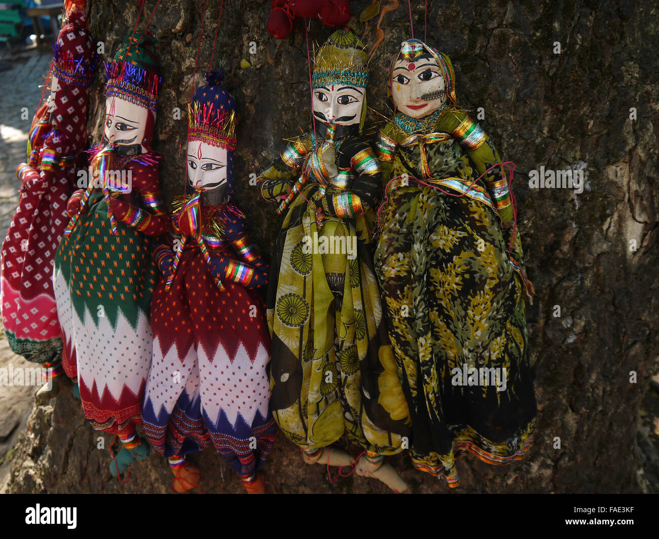 Puppet display hanging from a tree bark . Kochi India Stock Photo - Alamy