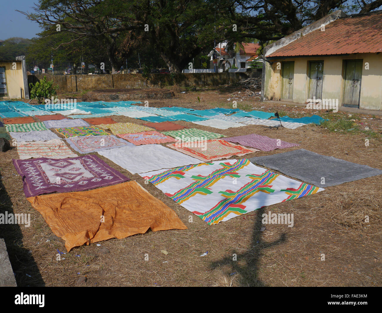 Rows of washing lines with drying hanging washing . Community laundry ...