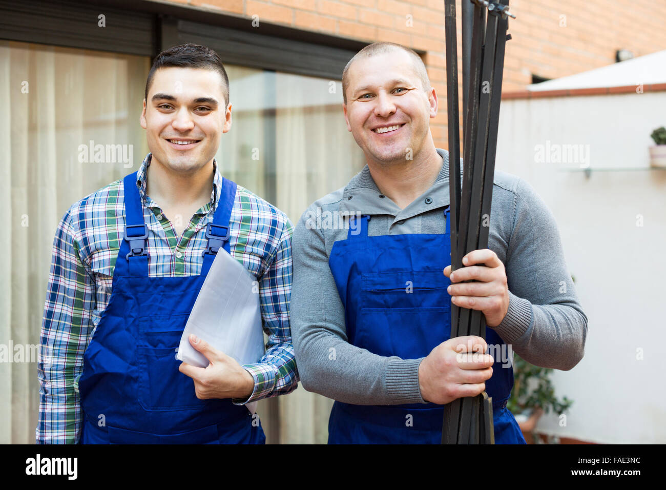 Portrait of two smiling positive professional workers in uniform Stock ...