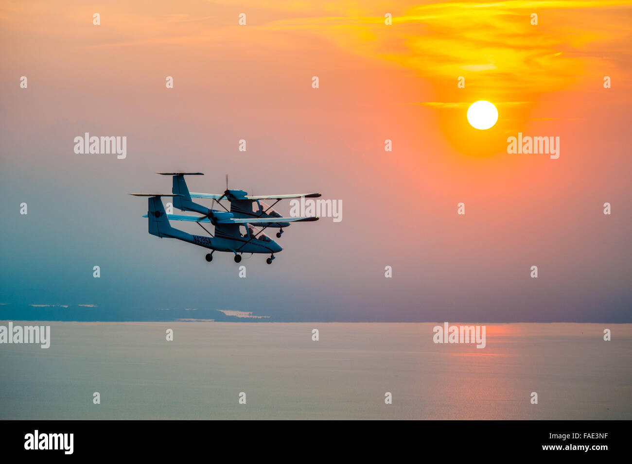 Aerial view of two planes at sunset during a formation flight Stock ...