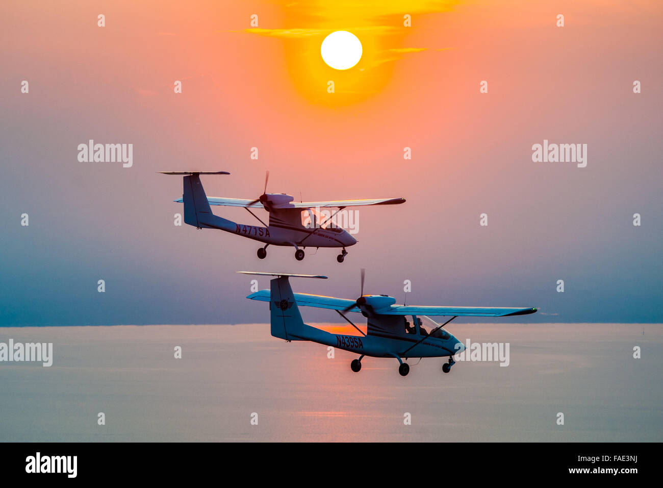 Aerial view of two planes at sunset during a formation flight Stock ...