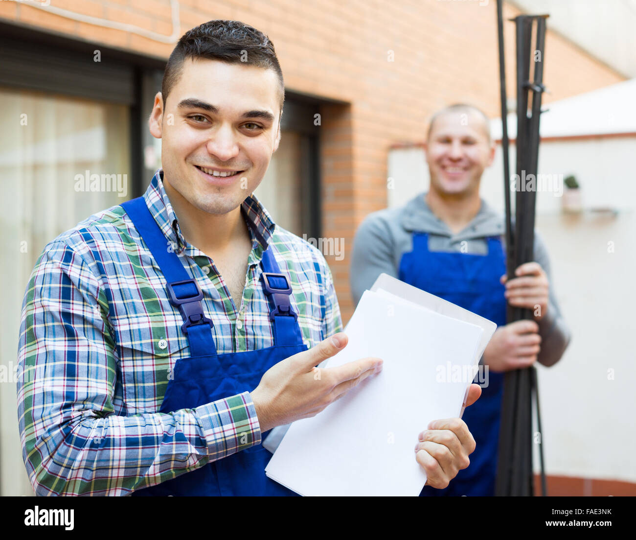 Portrait of two happy smiling professional workers in uniform Stock ...