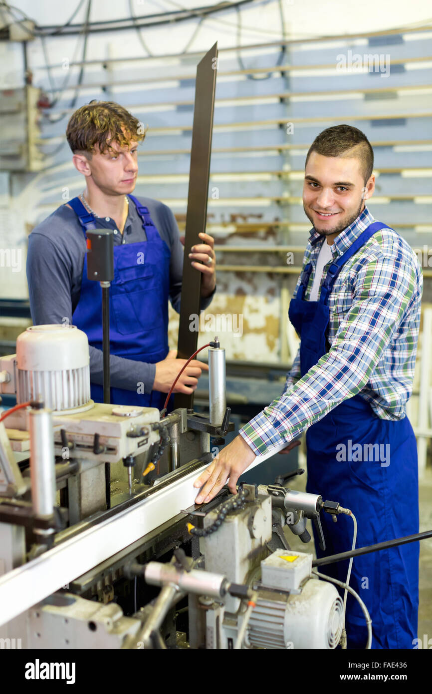 Factory workers operating pvc frame hi-res stock photography and images ...