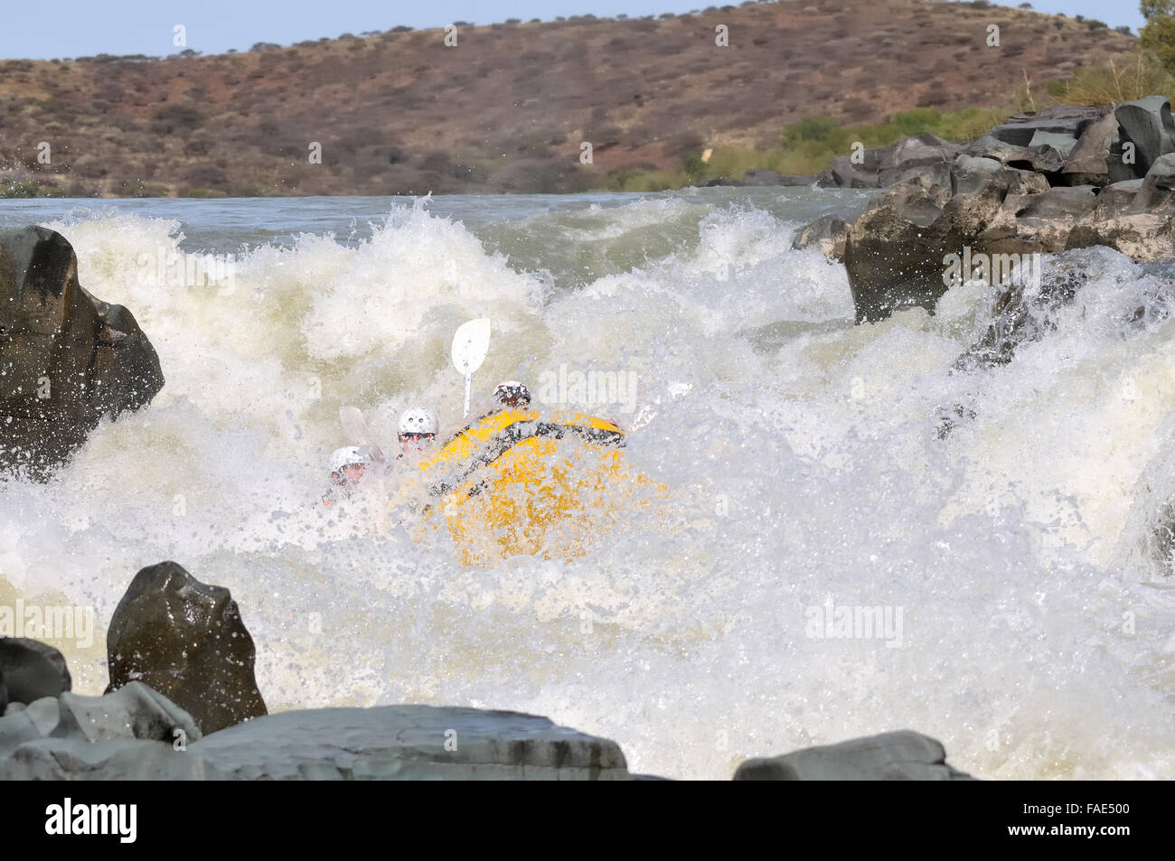 White water rafting: an inflatable raft going down Hell's Gate in the ...
