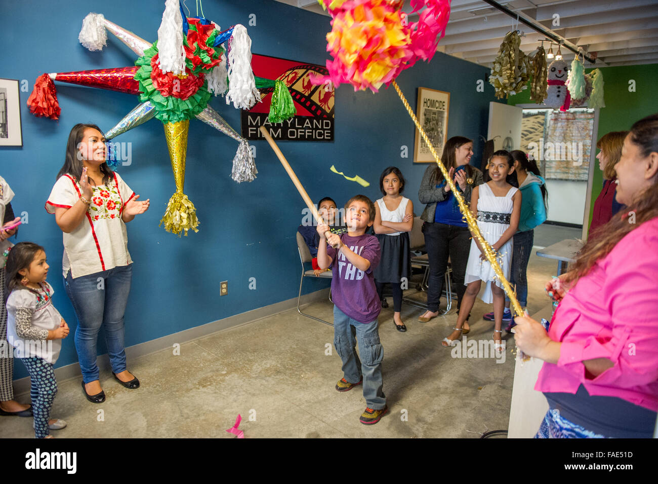 Mexican family playing with their hand made pinata Stock Photo - Alamy