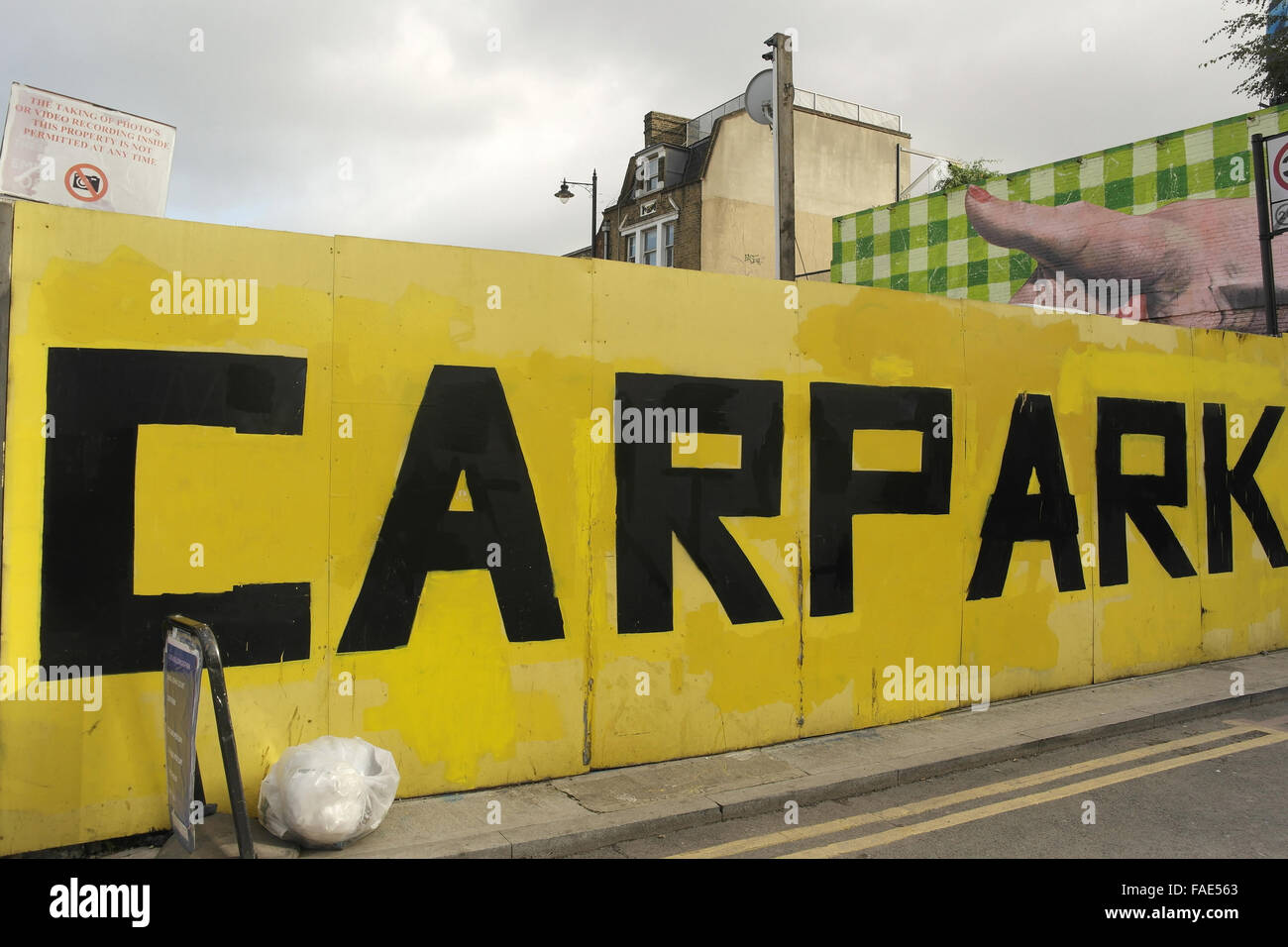 No photographs sign above yellow black type Car Park board, towards ...