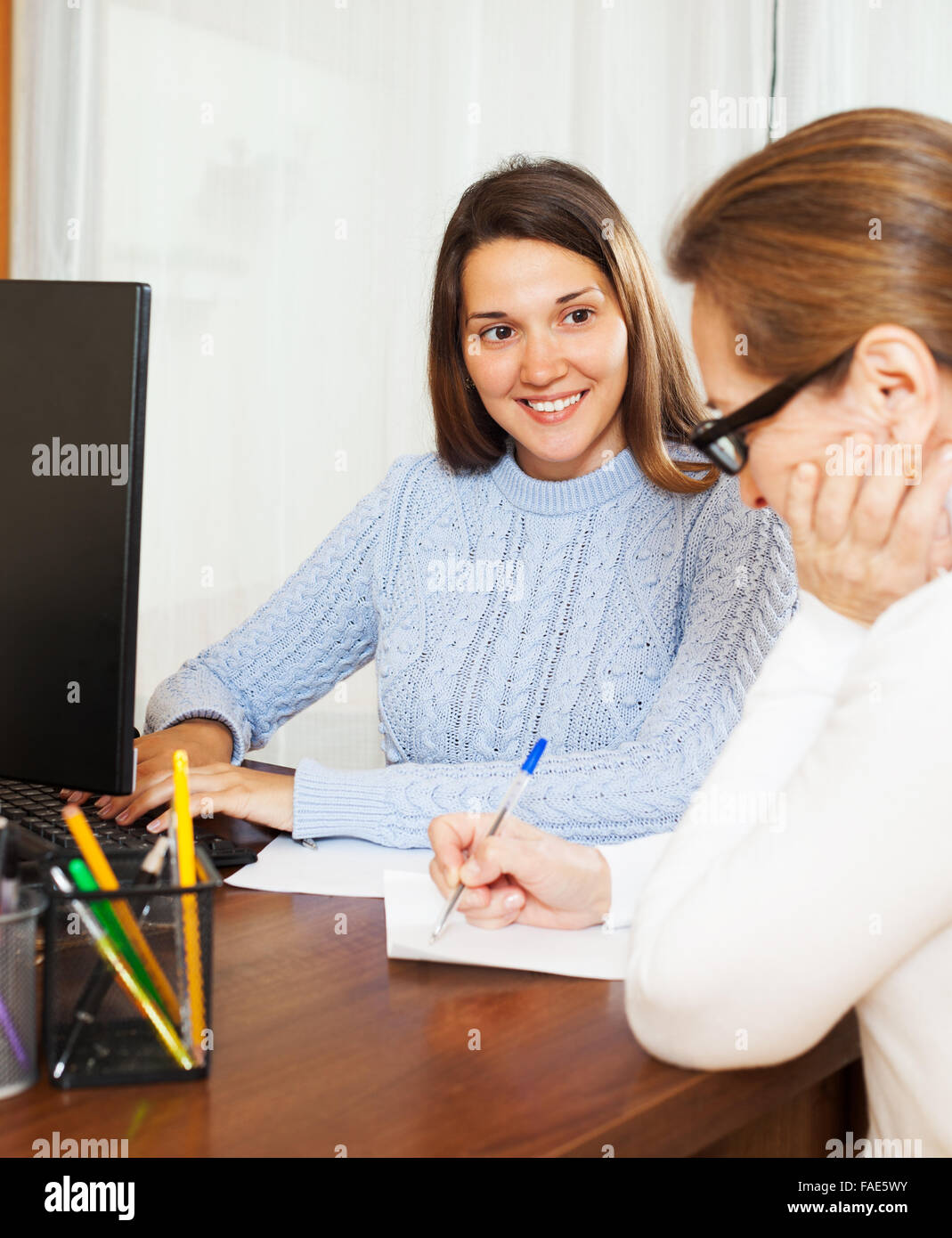 woman answering questions of employee at office Stock Photo - Alamy