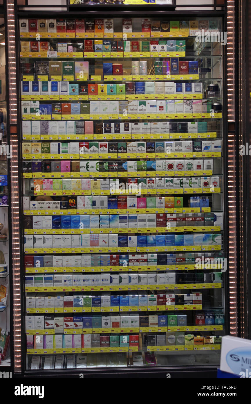 Cigarettes packets in tobacconist shop window Stock Photo - Alamy