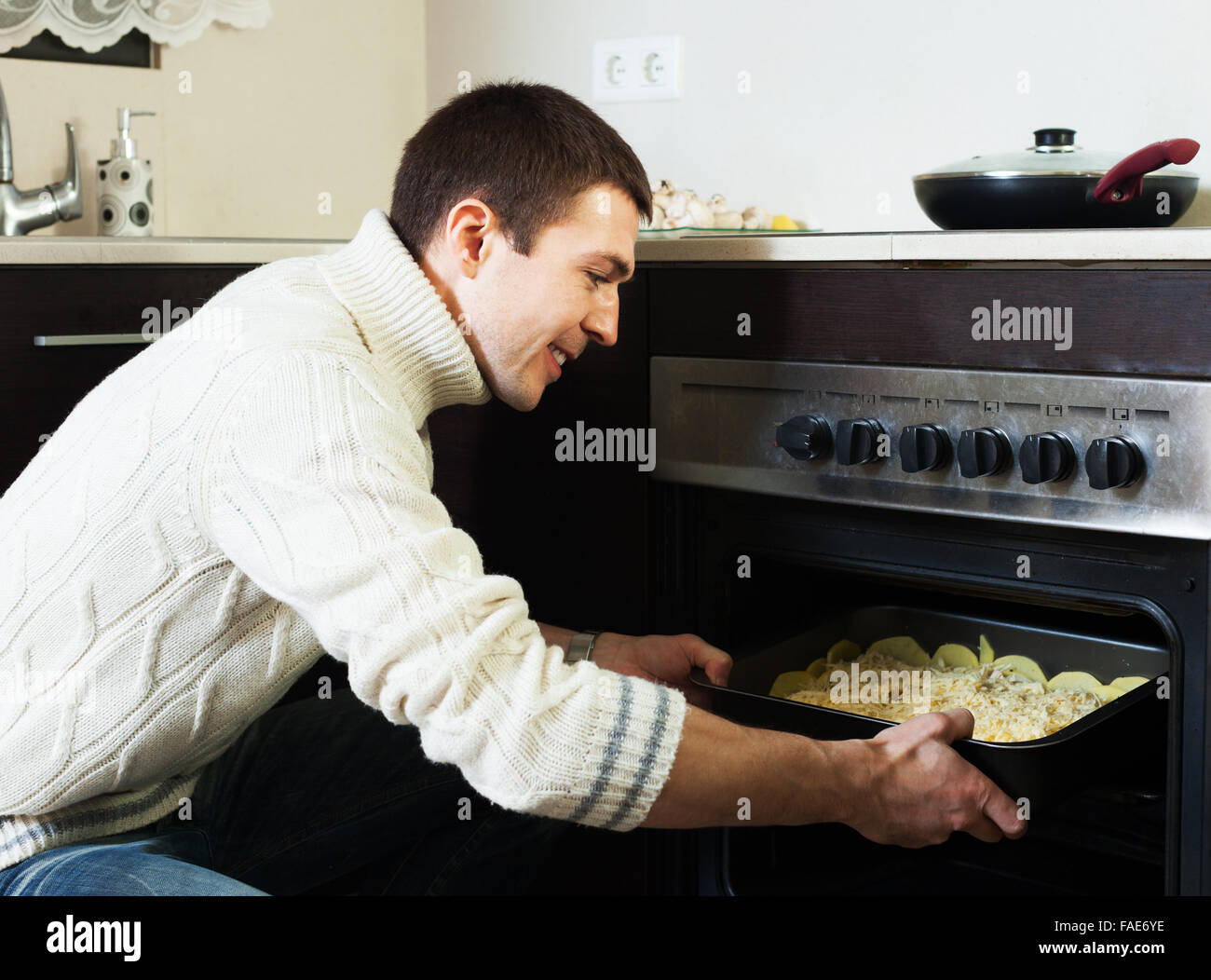 Smiling guy roasting meat in hi-res stock photography and images - Alamy
