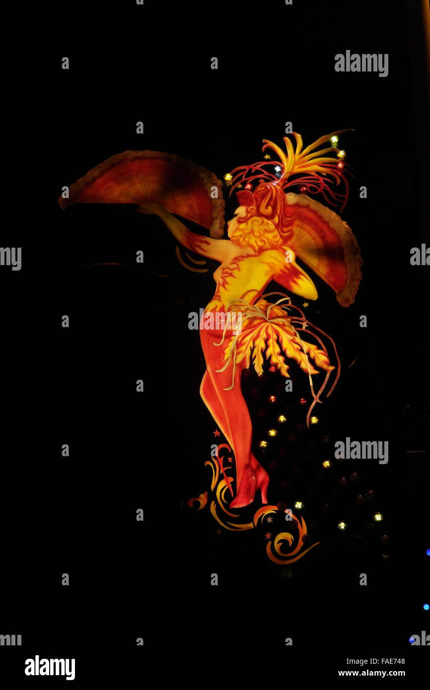 Night portrait red clothes burlesque beauty, looking left, holding fan ...