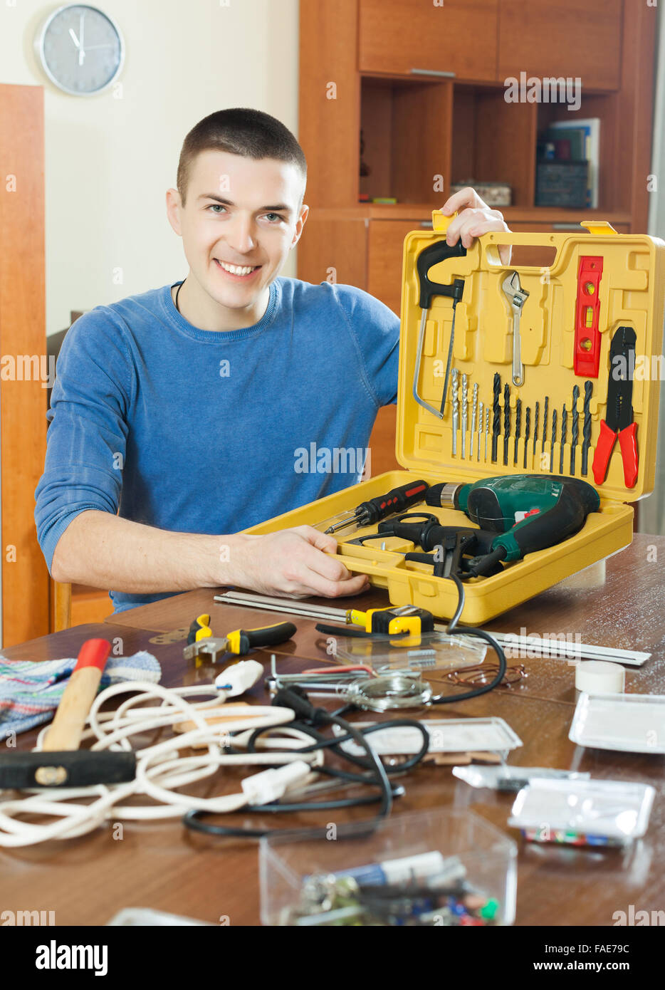 smiling guy with working tools Stock Photo - Alamy