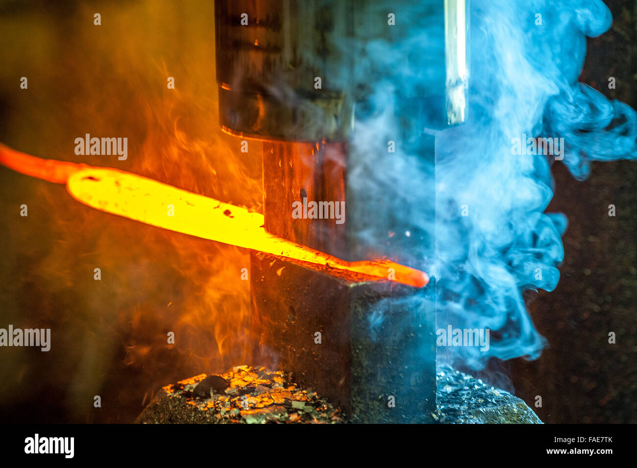 Blacksmith working on hot metal Stock Photo - Alamy