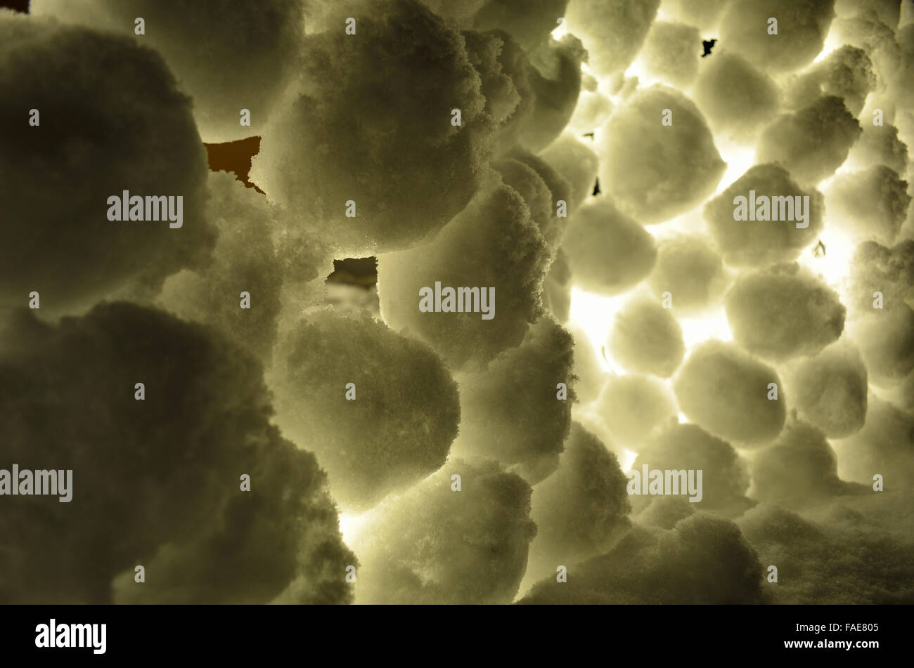 stacked snowball wall illuminated in winter night Stock Photo - Alamy