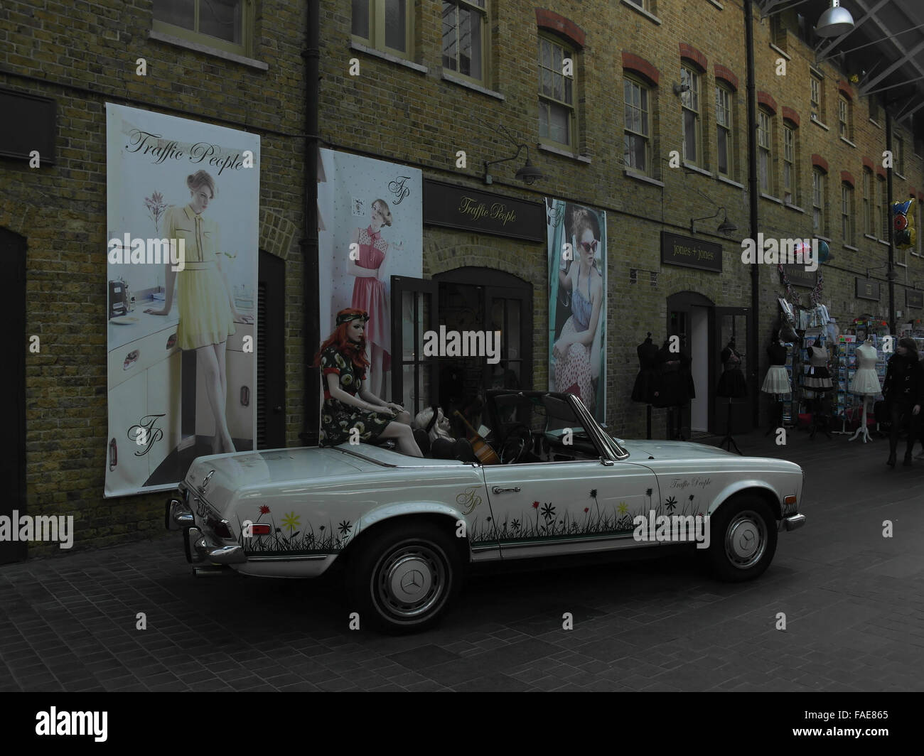 Old white open-top Mercedes car with vintage clothes manikins, Traffic ...