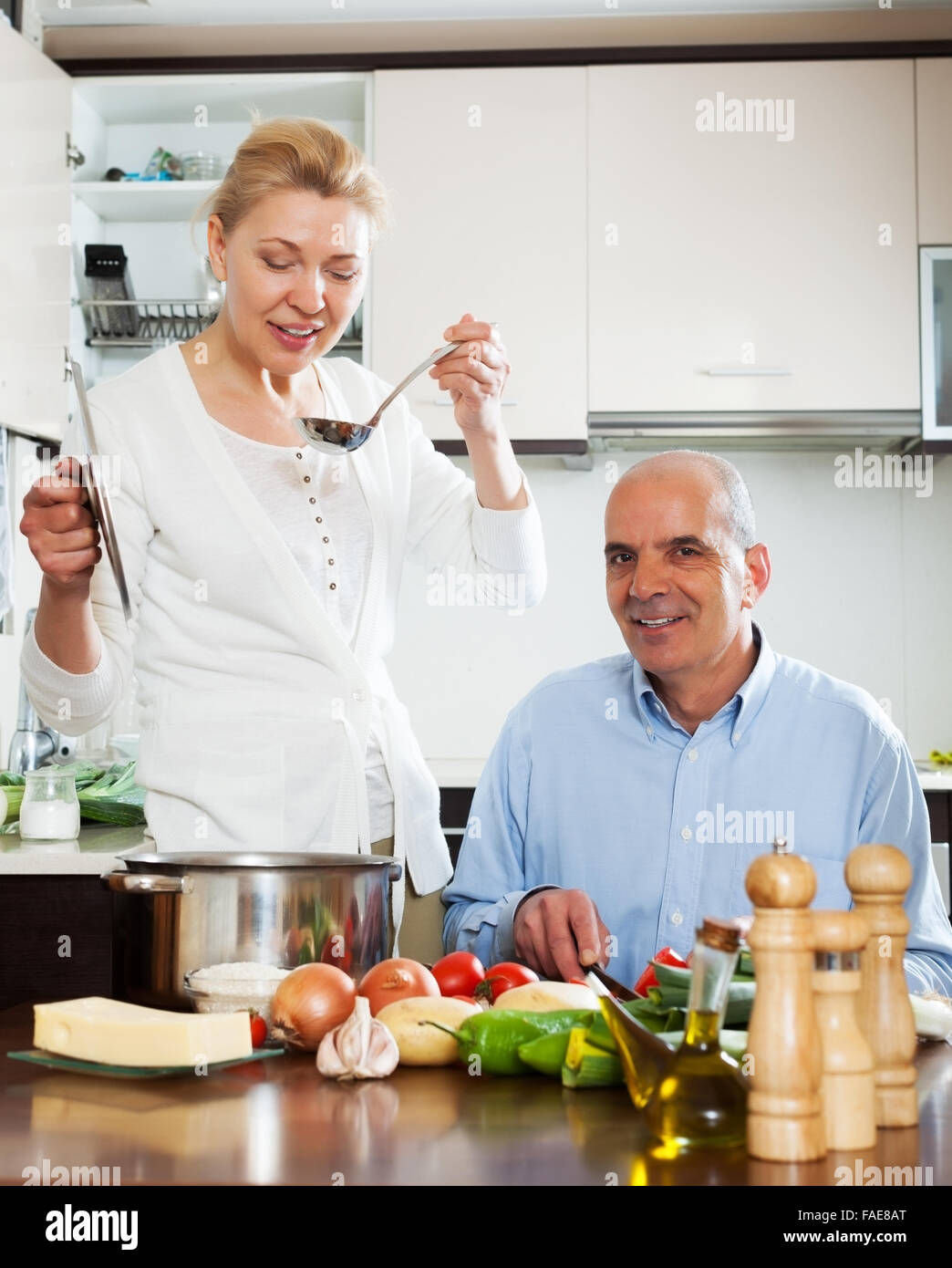 happy family cooking healthy food at home Stock Photo - Alamy