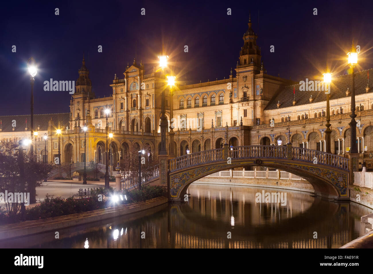 night view of Plaza de Espana with bridges. Seville, Spain Stock Photo ...